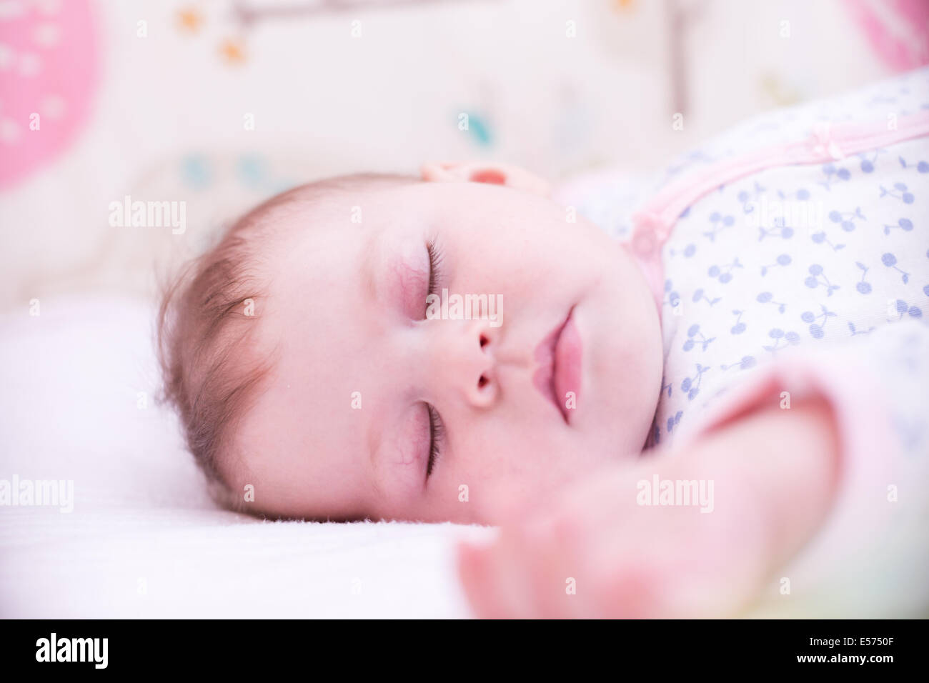 Cute baby girl sleeping in her crib Stock Photo - Alamy