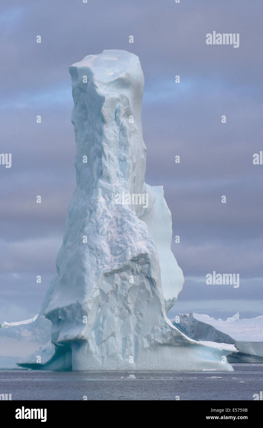high iceberg as a column in the summer Antarctic waters Stock Photo - Alamy