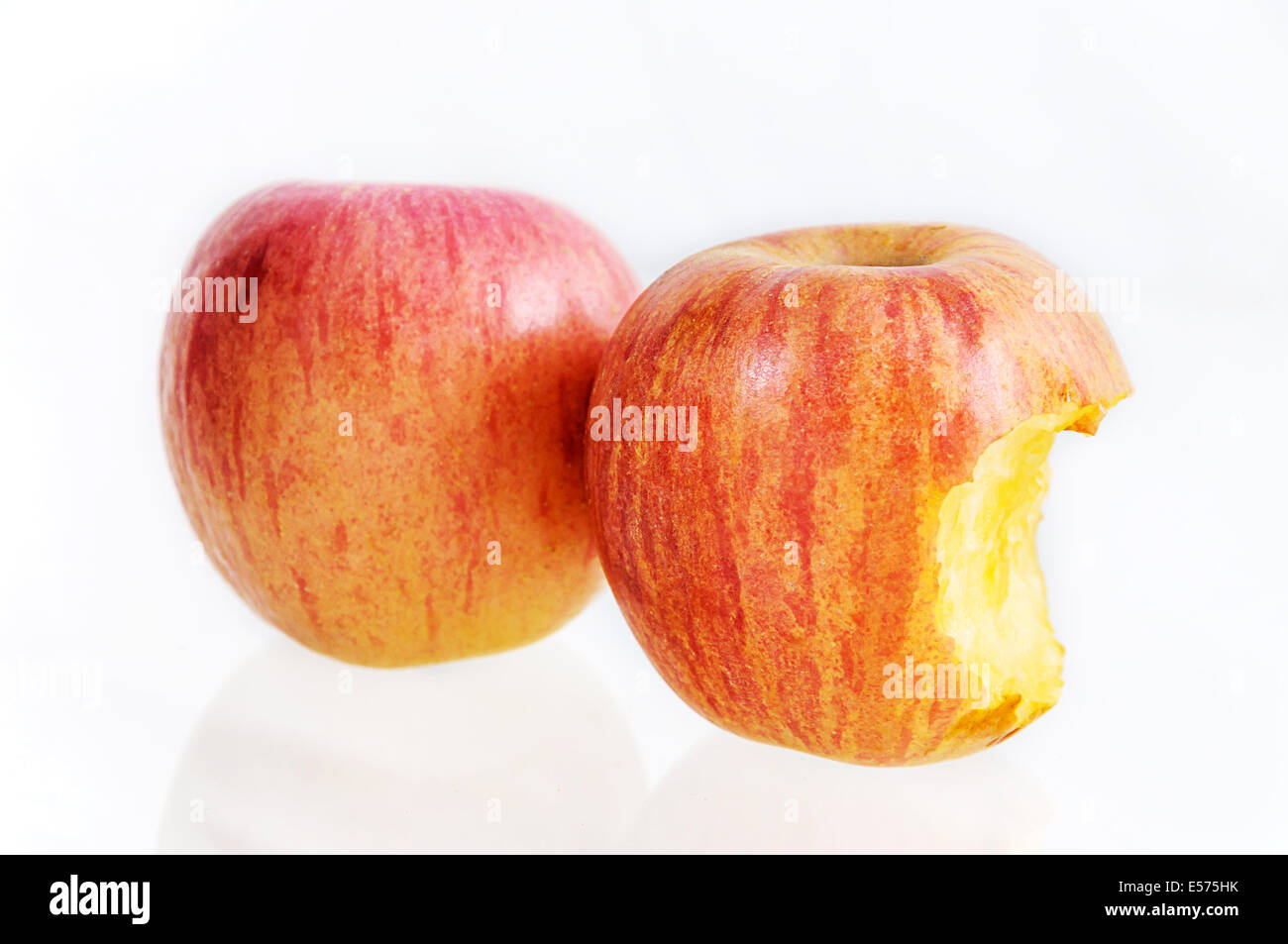 Apple bitten isolated on white background Stock Photo - Alamy