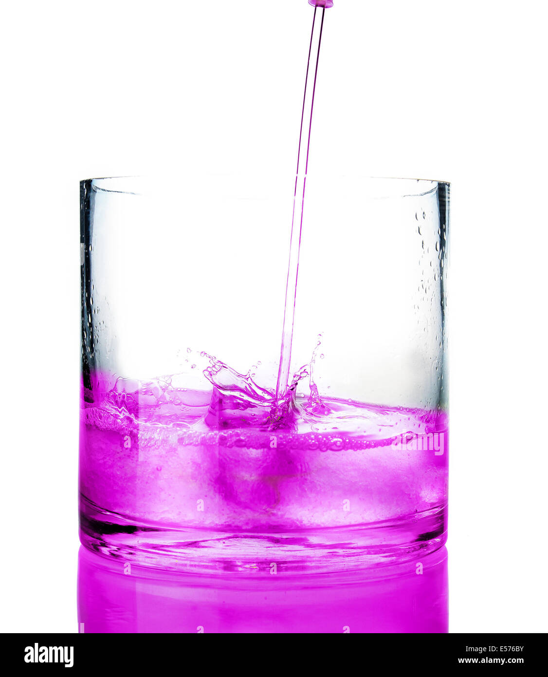 Soap Splash into Purple Colored Water in Glass Bowl Stock Photo - Alamy