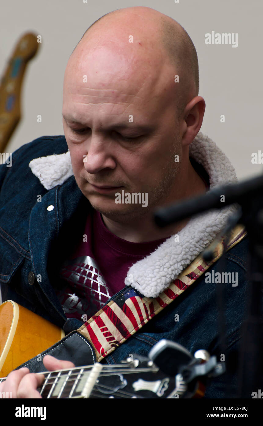 Lyndon Anderson's guitarist performing at the Mardi Gras, part of the ...