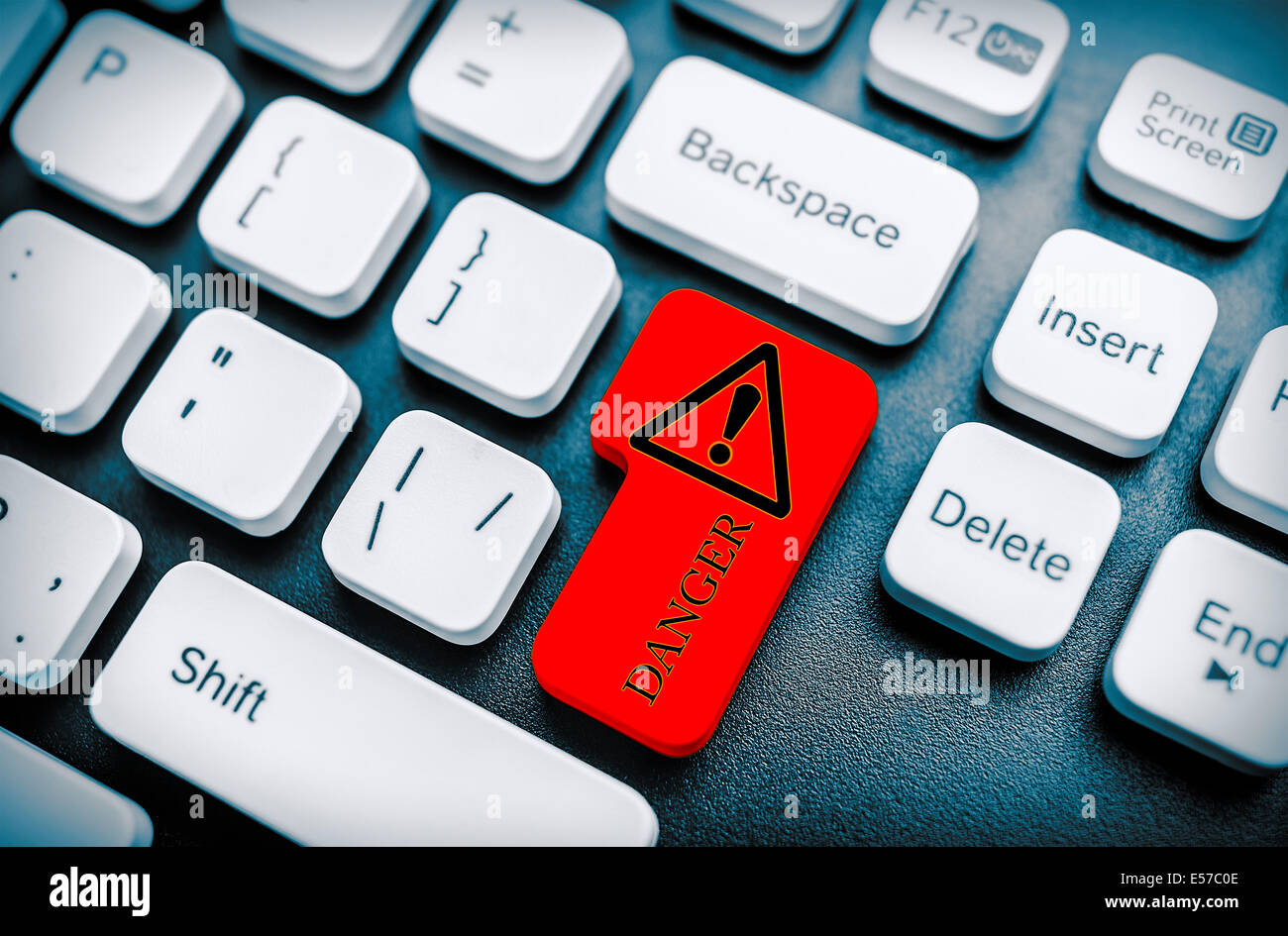 Keyboard with danger red button. Concept image Stock Photo - Alamy