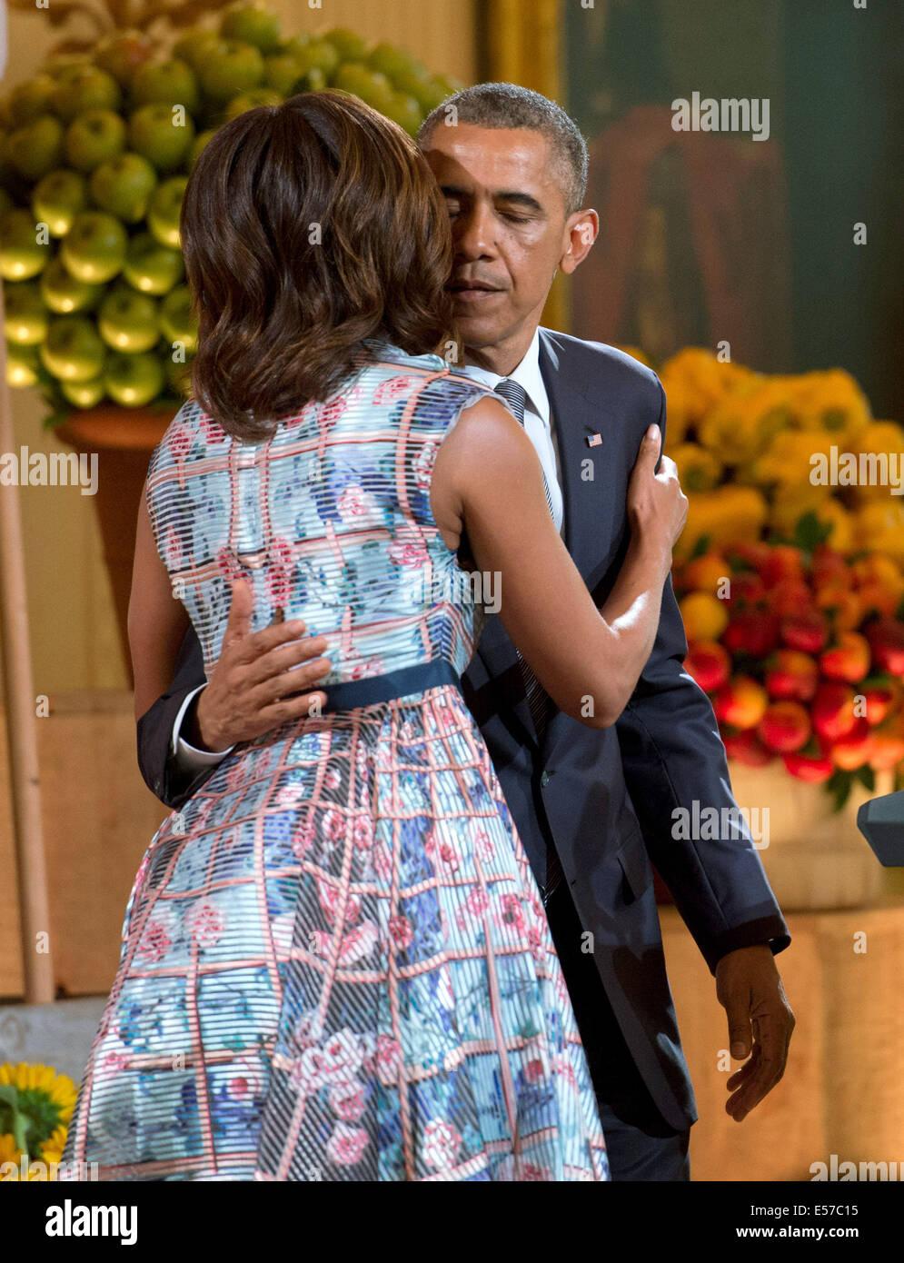 United States President Barack Obama kisses First Lady Michelle Obama ...