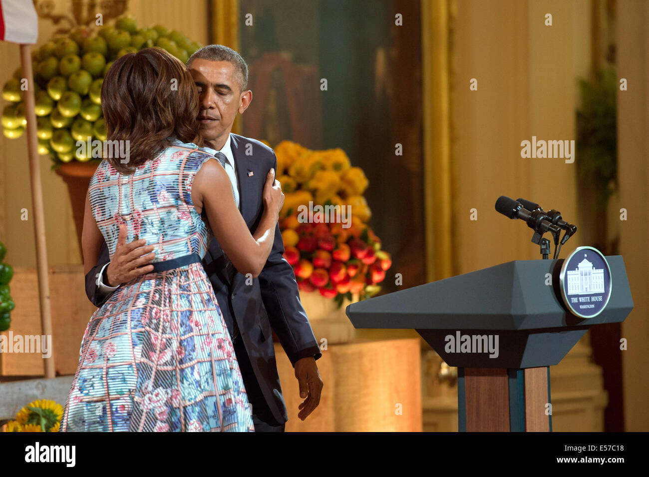 United States President Barack Obama kisses First Lady Michelle Obama ...