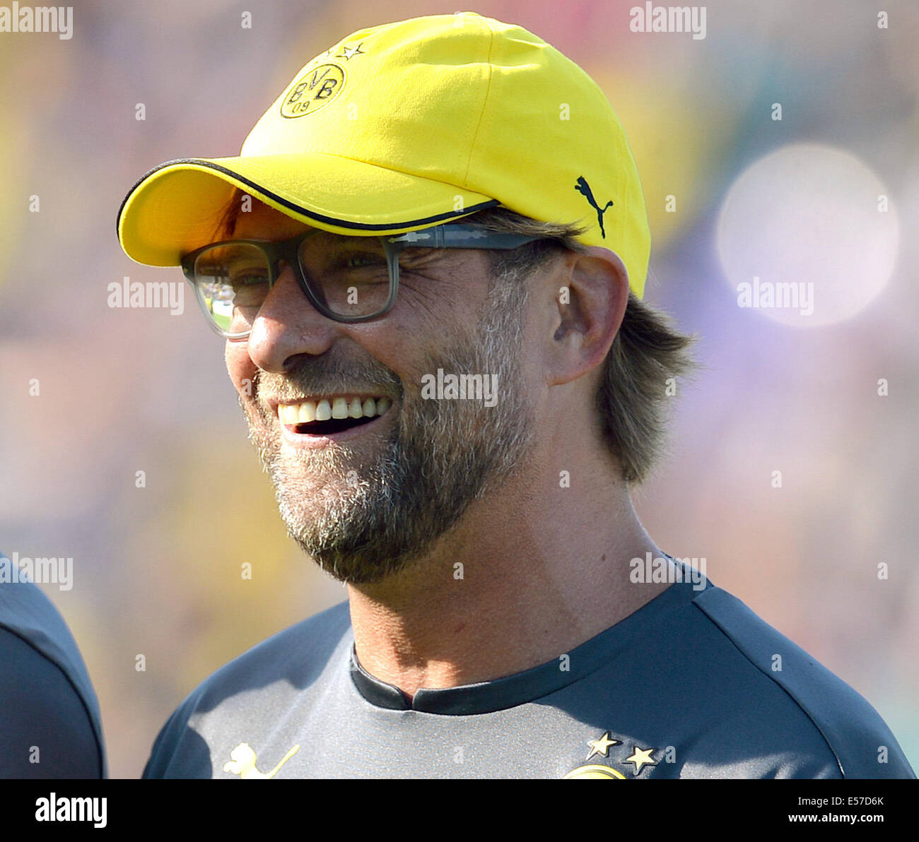 Dortmund's head coach Juergen Klopp smiles on the way to the benches ...