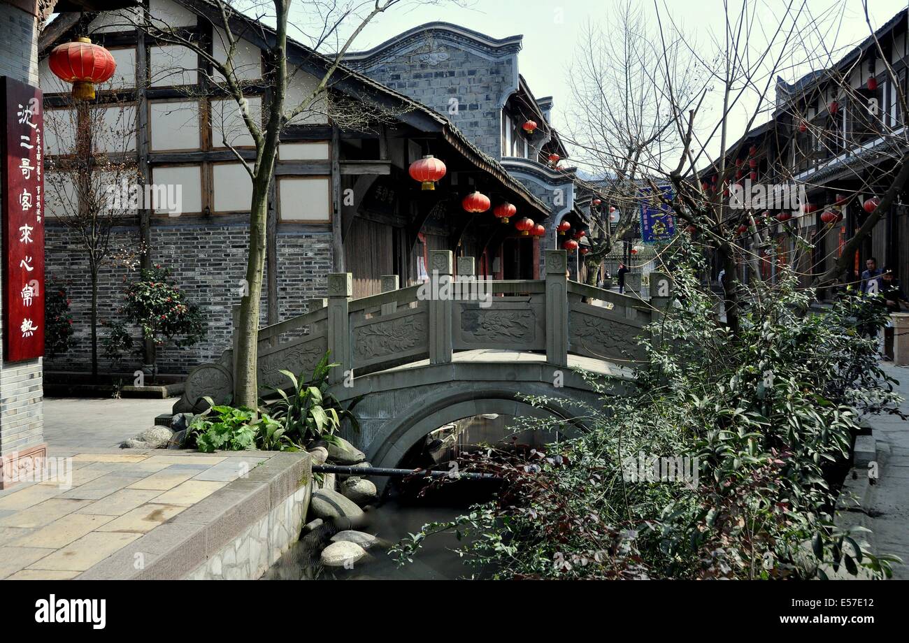 XIN XING ZHEN, CHINA: A stone bridge with bas relief designs spans a ...