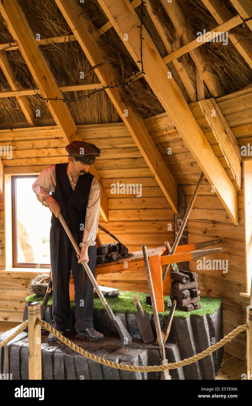 Diorama of bog worker cutting turf at the Lullymore heritage and ...
