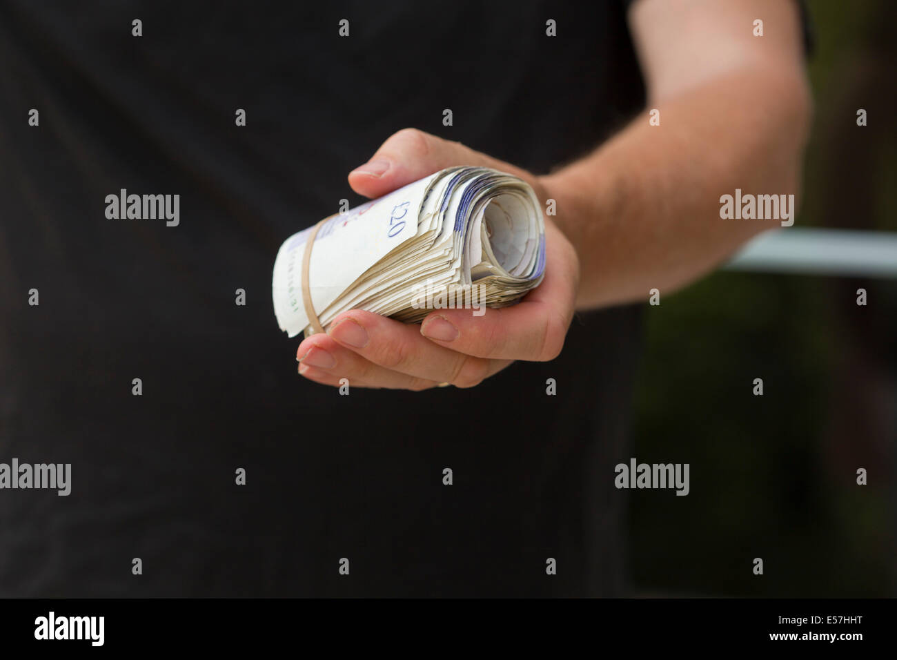 Fist with money sterling hi-res stock photography and images - Alamy