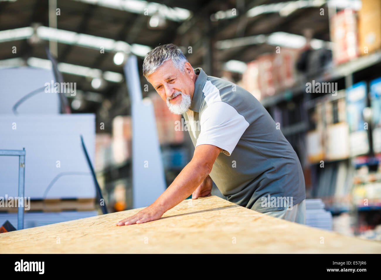 Man choosing and buying construction wood in a DIY store for his DIY ...
