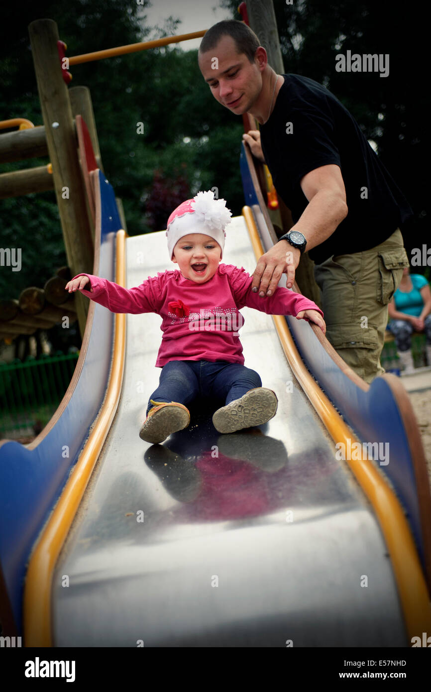Little girl slide hi-res stock photography and images - Alamy