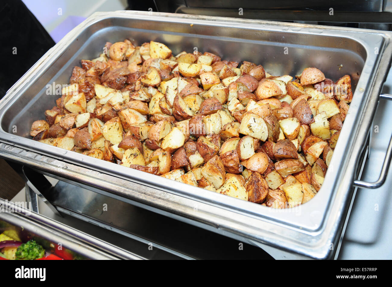 All you can eat potatoes being served at a wedding in a fancy metal ...