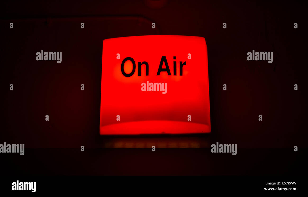 Red On Air illuminated sign recording studio Stock Photo - Alamy