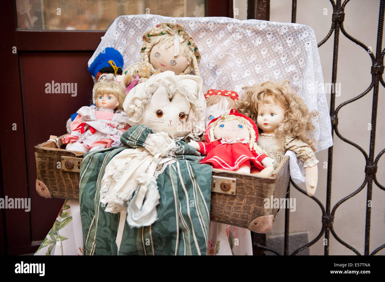 Retro rag dolls toys collection lying in old suitcase Stock Photo - Alamy