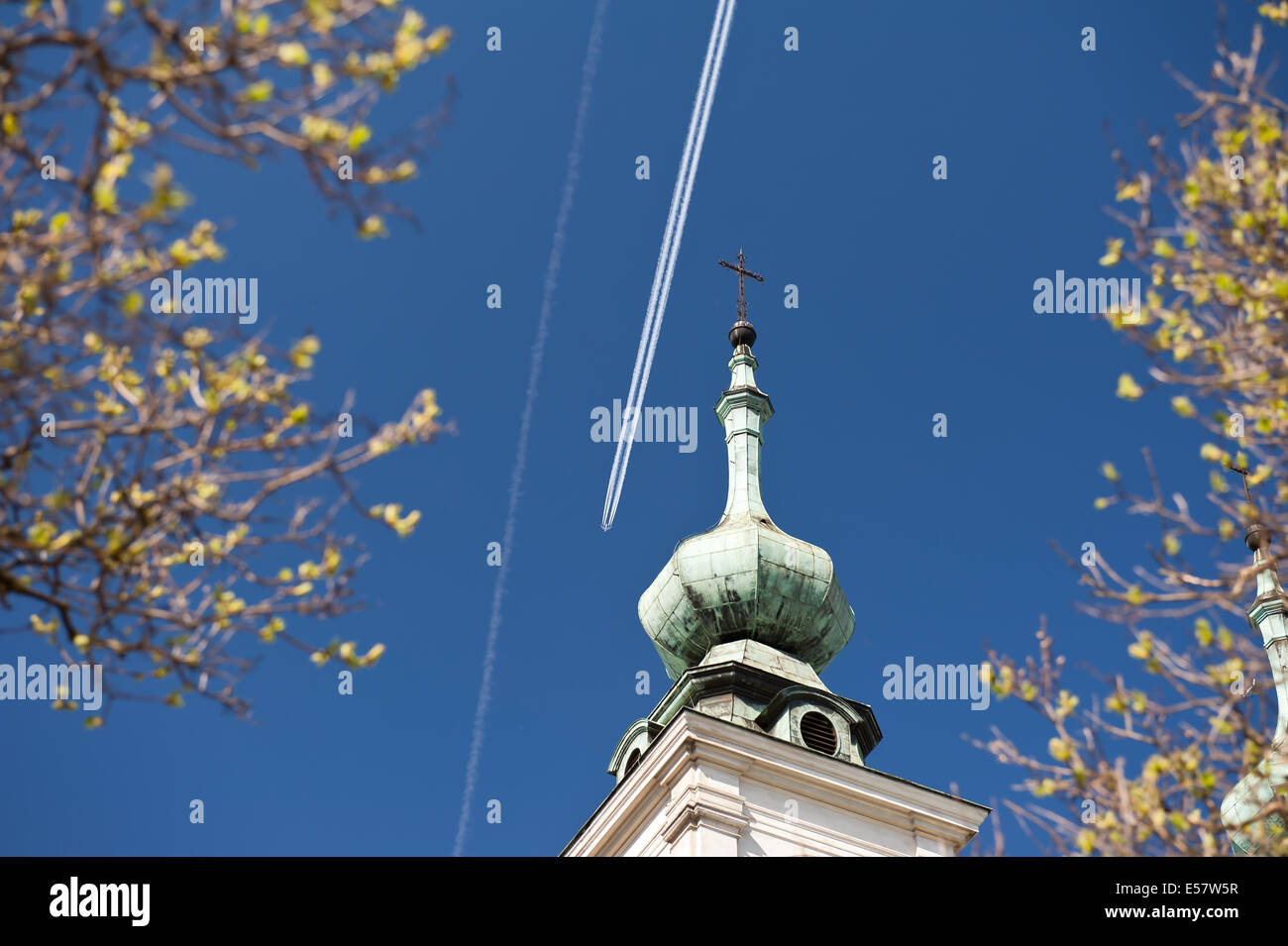 Aeroplane contrails and cross on turret Stock Photo - Alamy