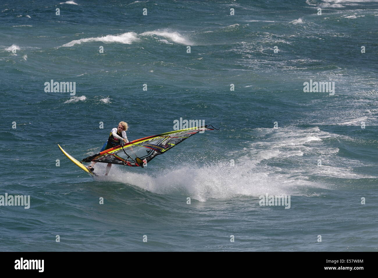 A windsurfer riding a wave Stock Photo - Alamy