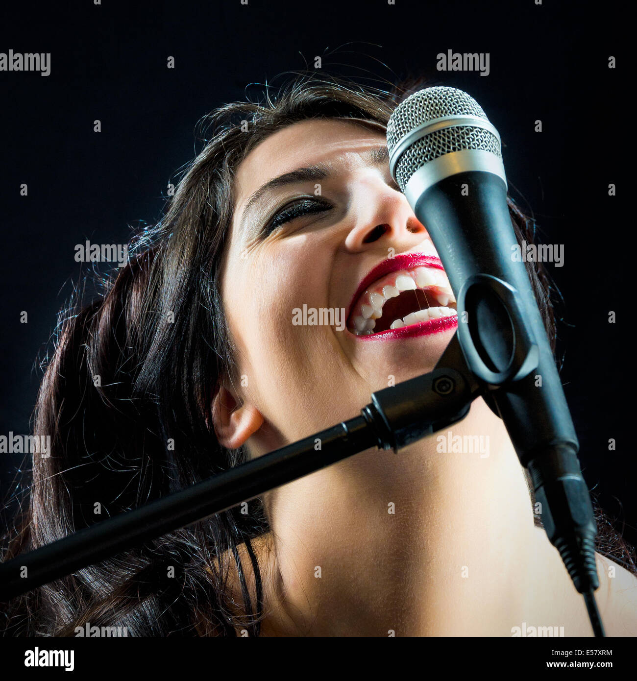Black woman singing into microphone hi-res stock photography and images - Alamy