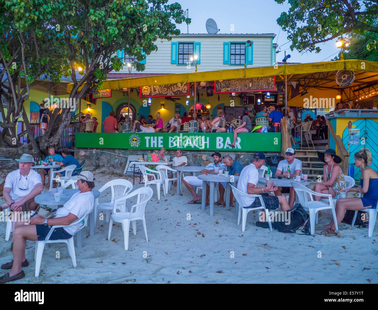 People at outdoor restaurant and bar on beach in Cruz Bay on the ...