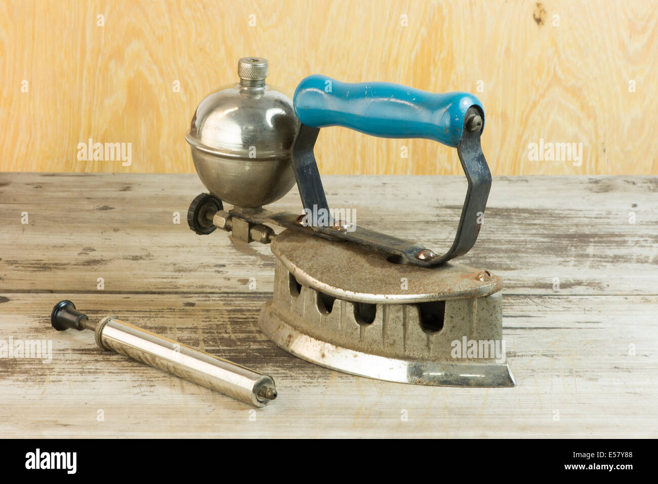 Antique iron, benzine powered featuring a round rear mounted fuel tank ...