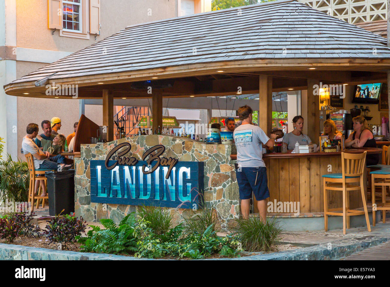 People at outdoor Cruz Bay Landing restaurant and bar in Cruz Bay on ...