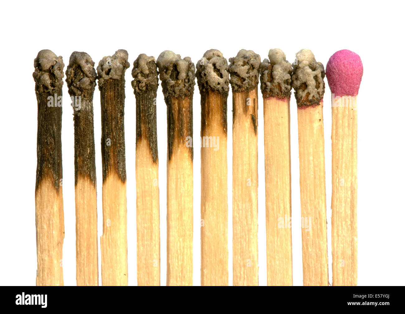 Conceptual image of many burnt matches plus an unused one left ...