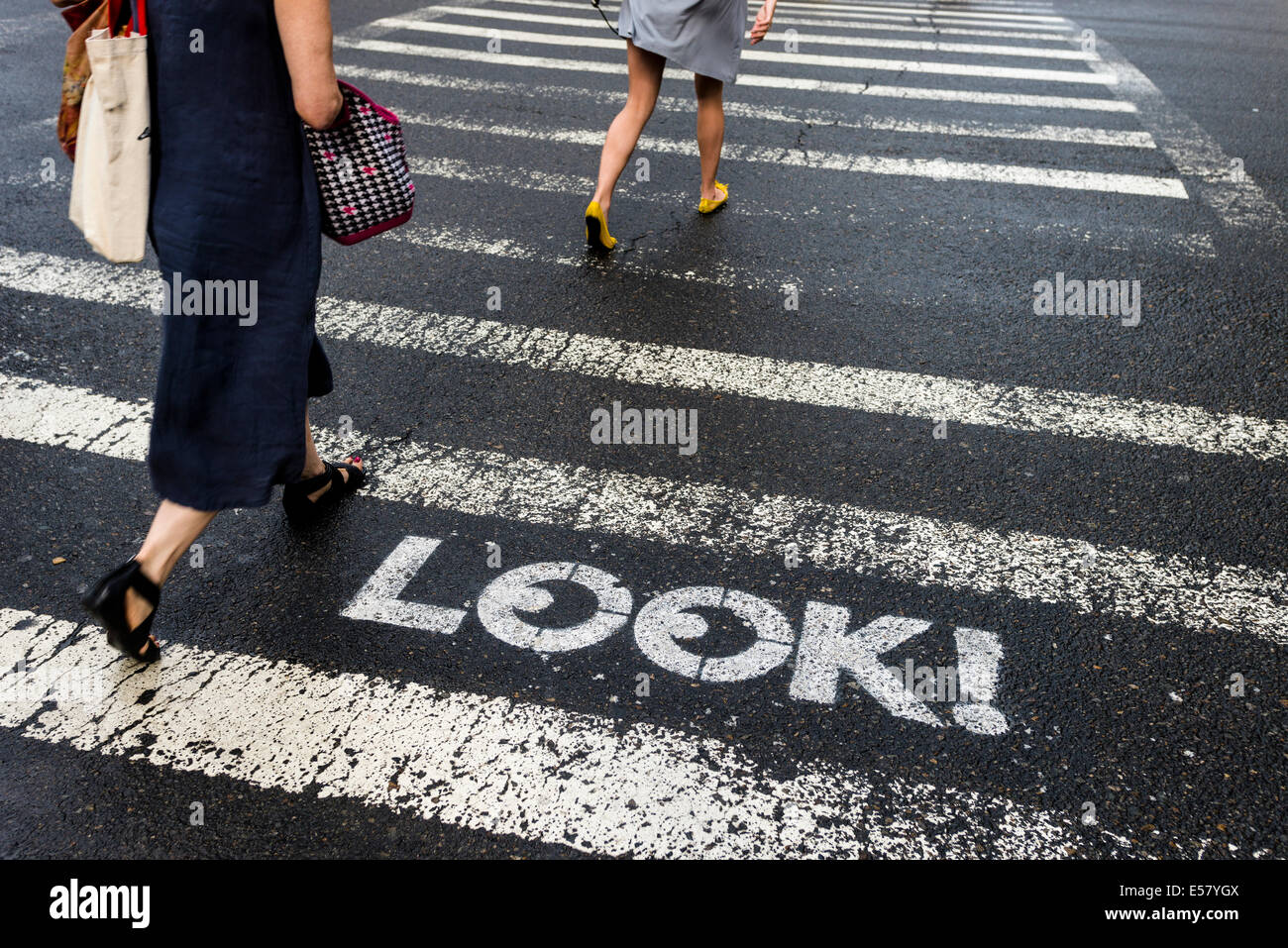 New York, NY 15 July 2014 - Pedestrians cross a street with the Look ...