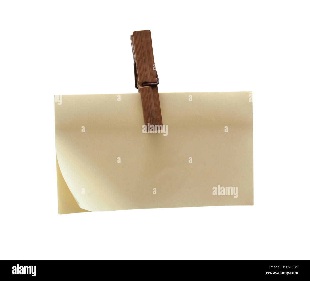 Clothes pin holding blank note isolated Stock Photo - Alamy