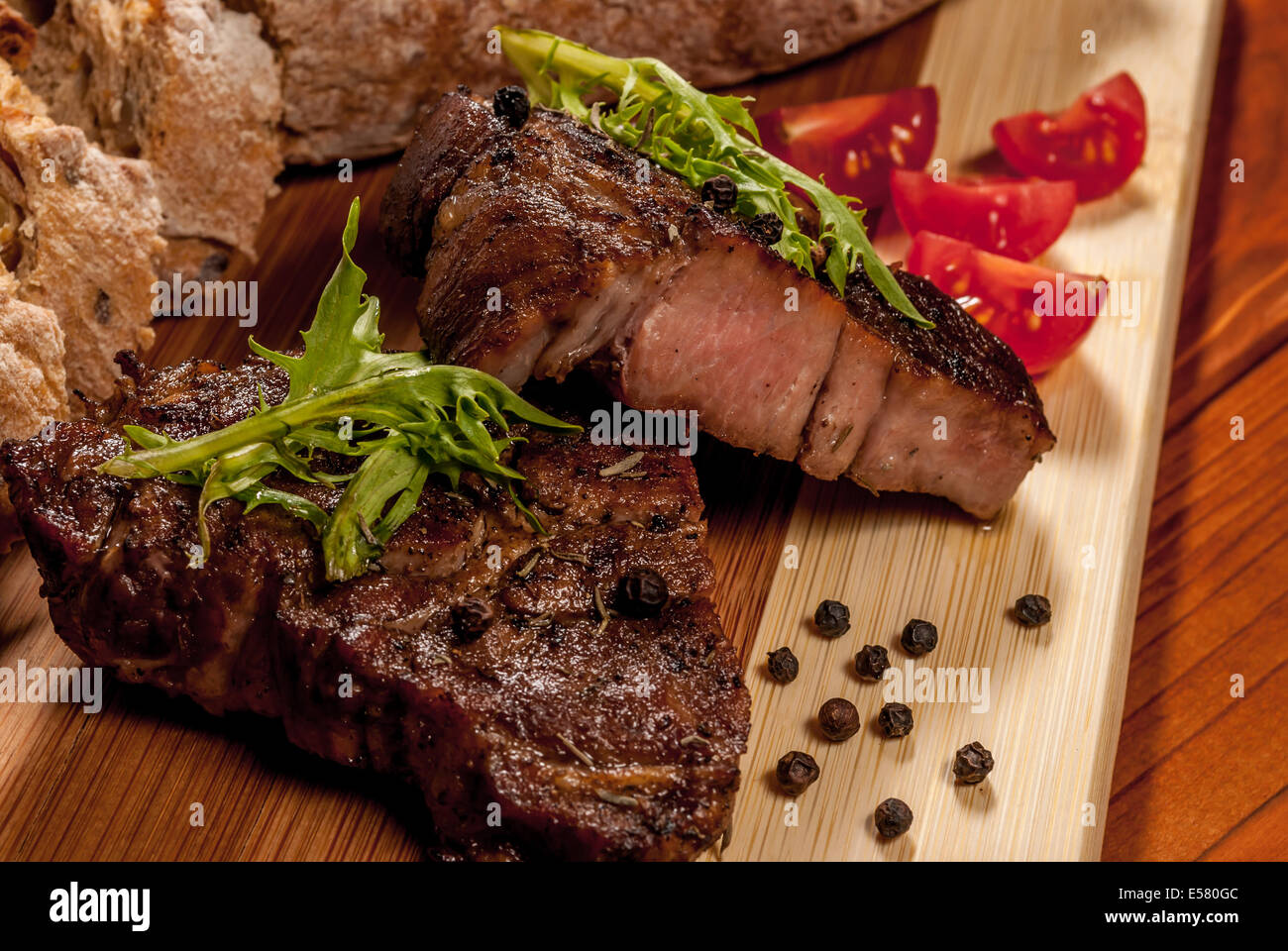 Pork neck steak with vegetables and peper Stock Photo - Alamy