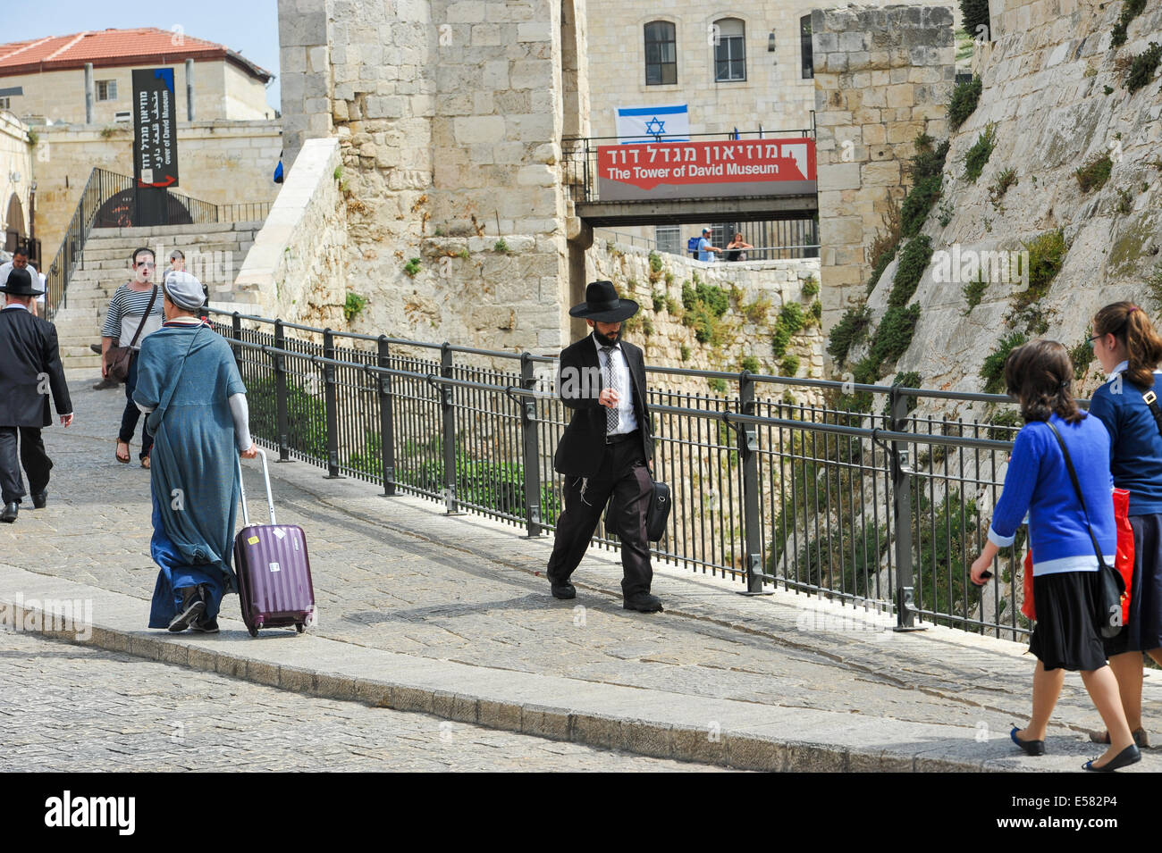 People walking by the wall of the old city of Jerusalem, Israel Stock ...