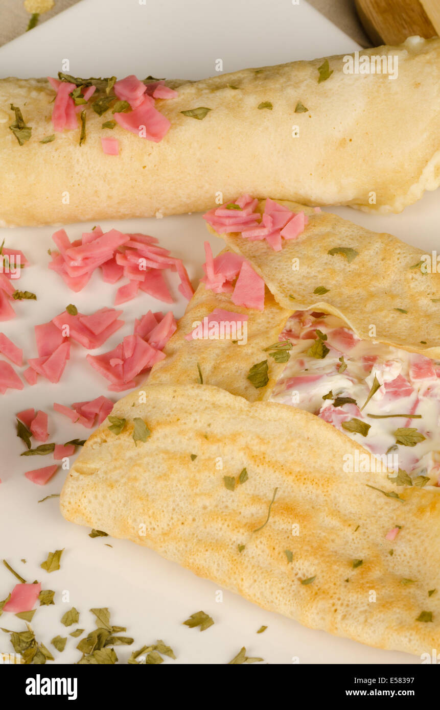 Folded crepe stuffed with fresh ham and cheese Stock Photo - Alamy