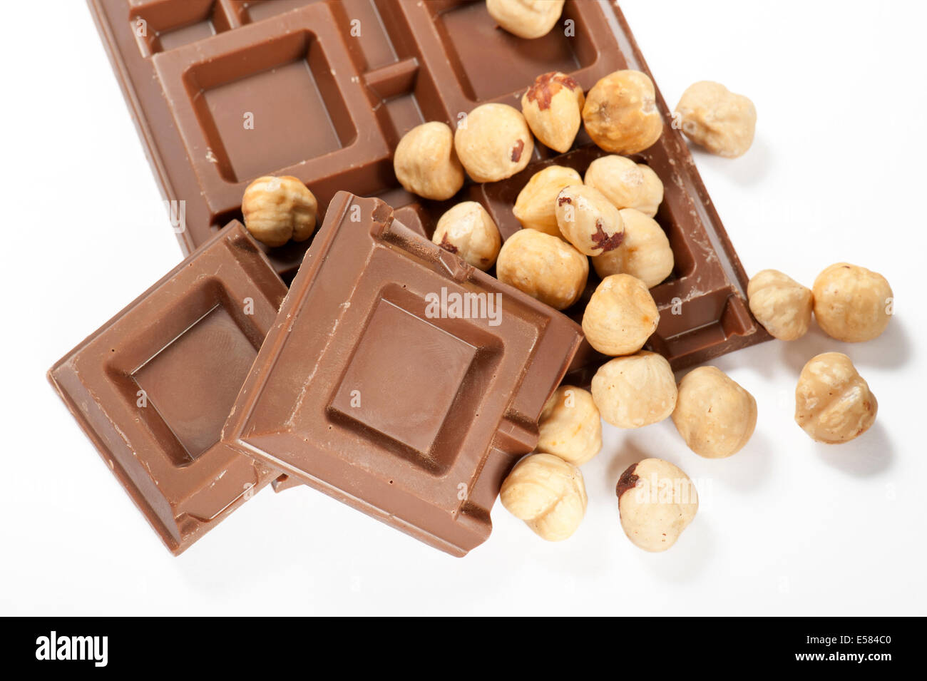 chocolate bar with nuts, on white background Stock Photo - Alamy