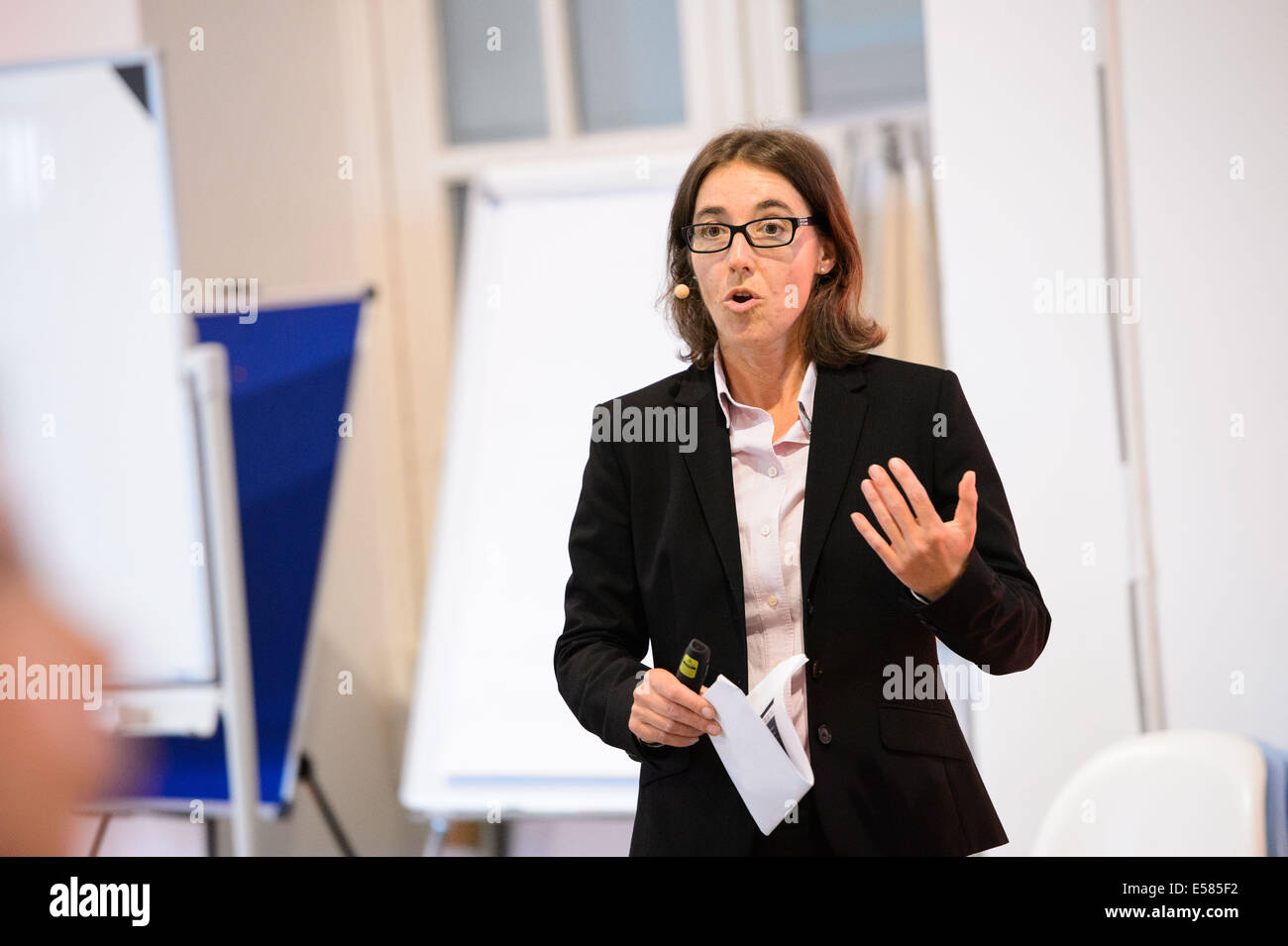 Munich, Germany. 22nd July, 2014. Susanne Steidl (Wirecard) gestures ...