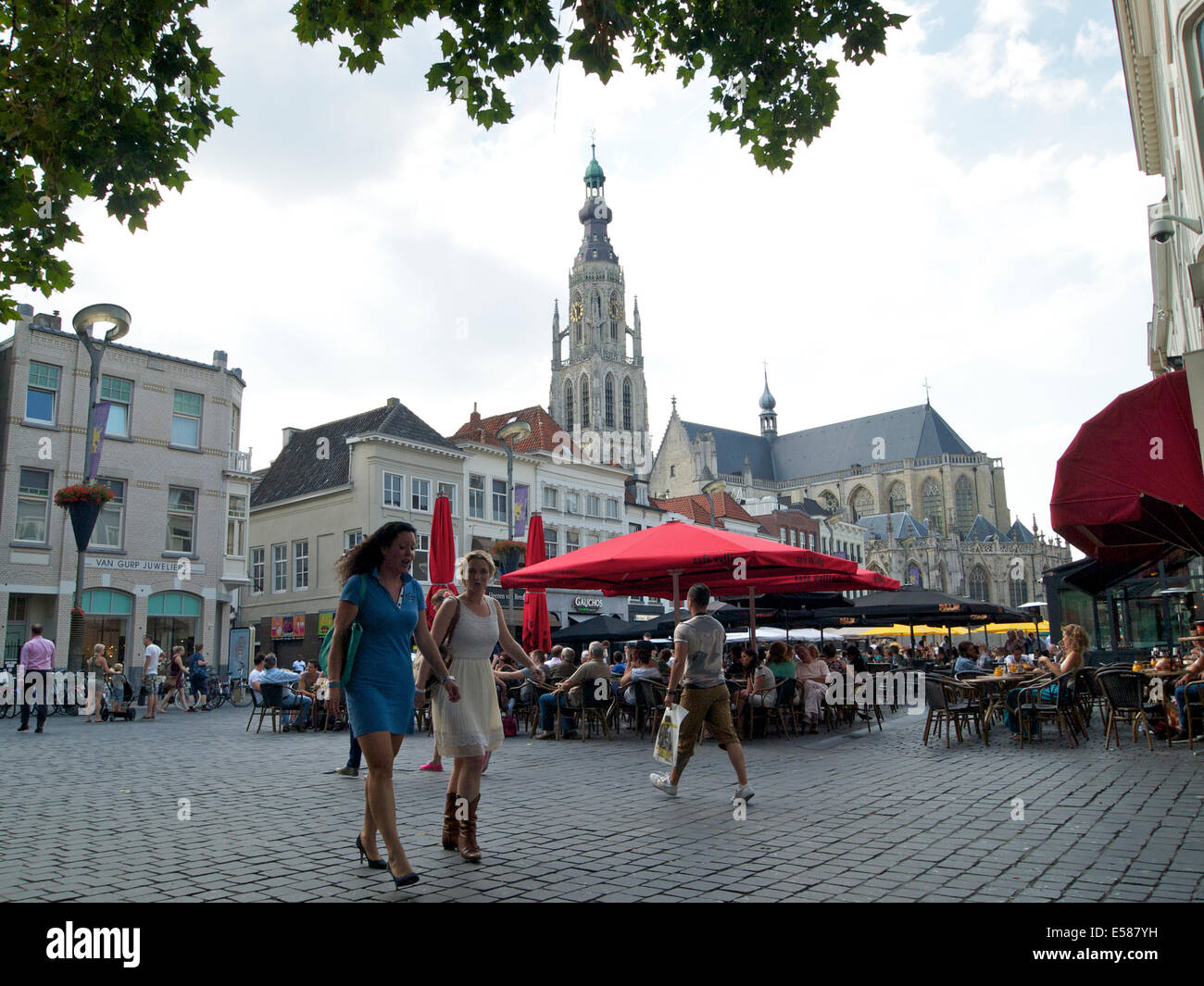 Summer afternoon in Breda, the Netherlands, with two ladies walking on ...