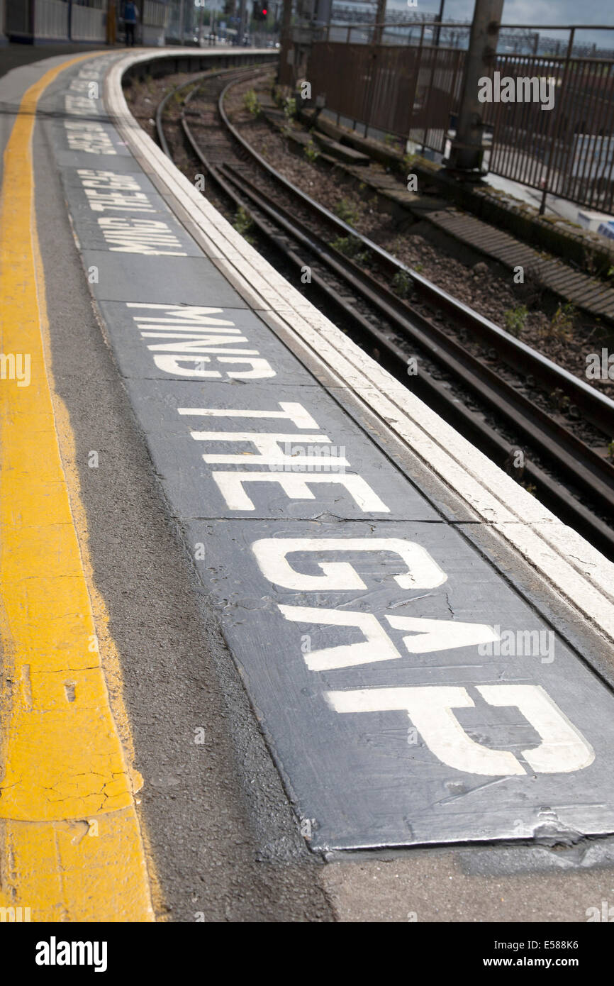 Closeup of Mind the Gap Platform Sign Stock Photo - Alamy
