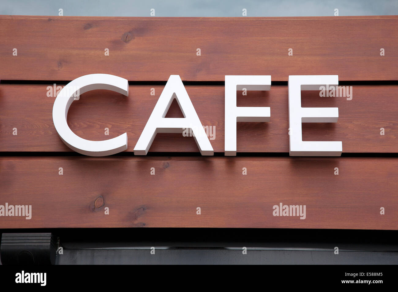 White Cafe Sign on Wooden Panel Background Stock Photo - Alamy
