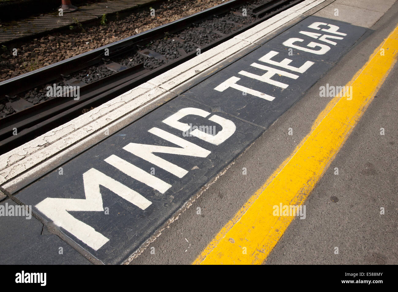 Closeup of Mind the Gap Platform Sign at Railroad Station on Diagonal ...