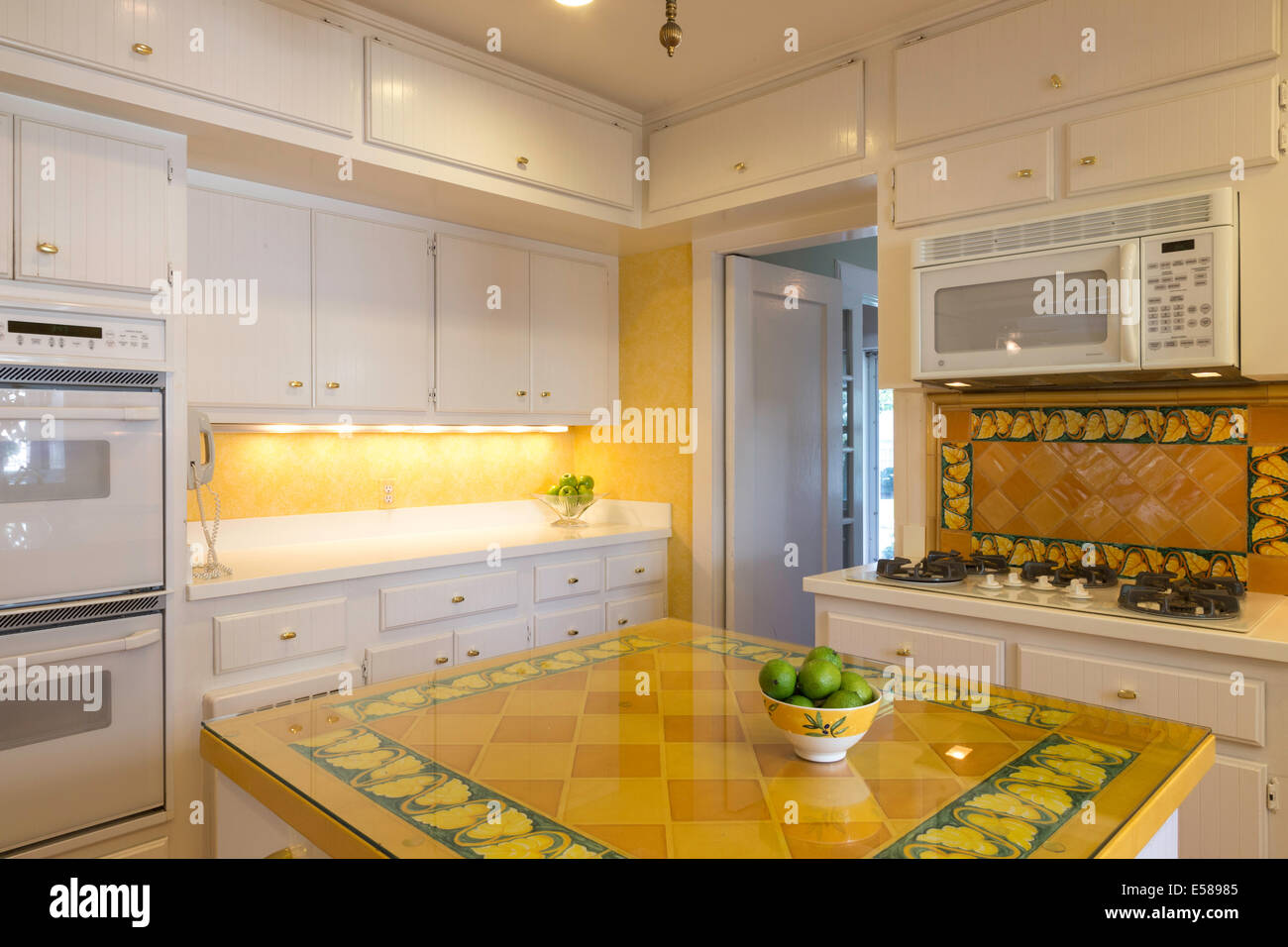 White Kitchen with Yellow Tile Accents, USA Stock Photo - Alamy