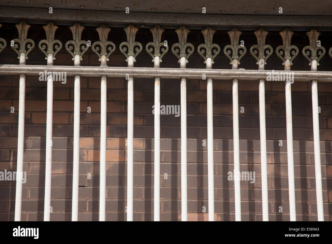 White Metal Railings on Brick Wall Background Stock Photo - Alamy