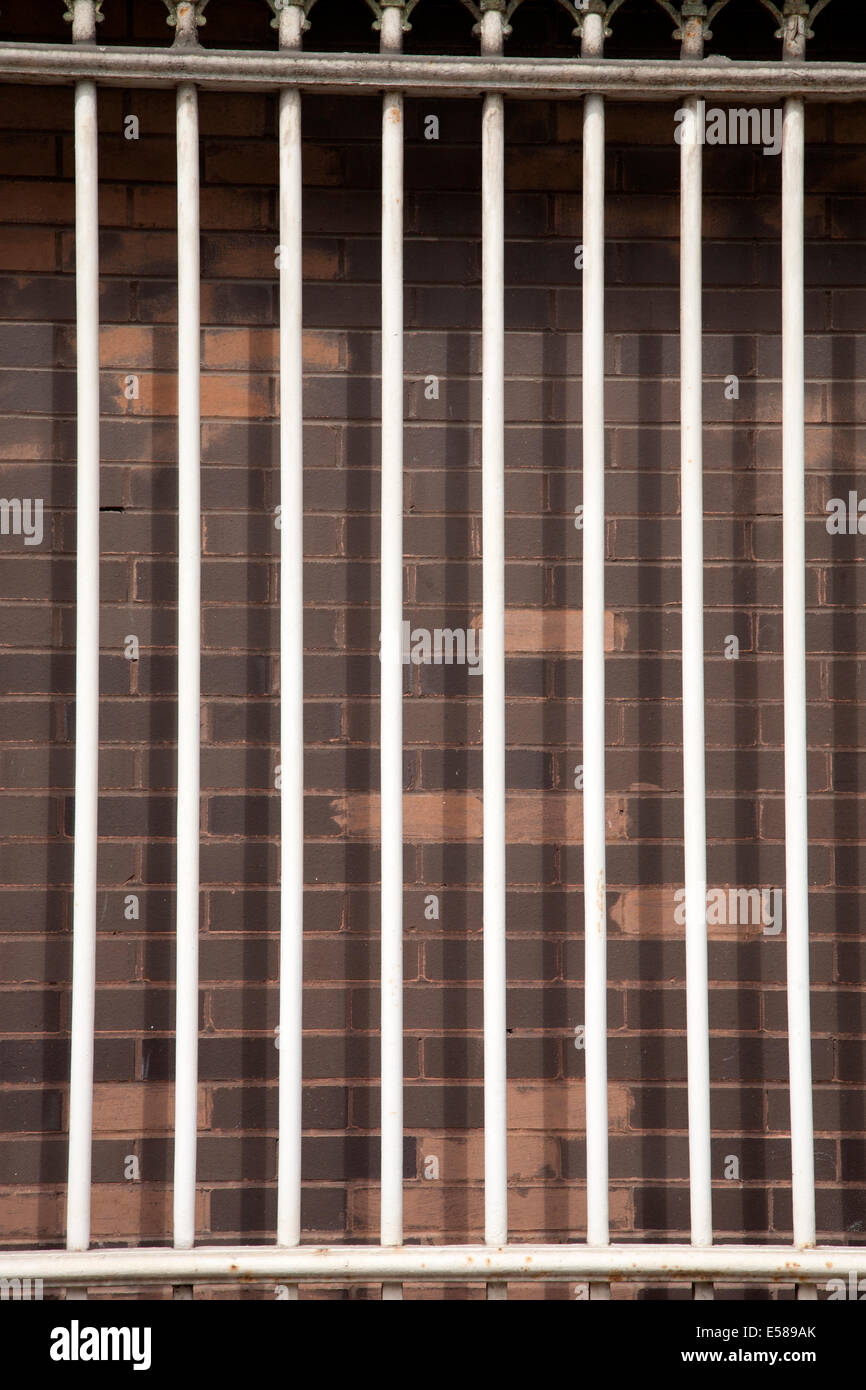 White Metal Railings on Brick Wall Background Stock Photo - Alamy