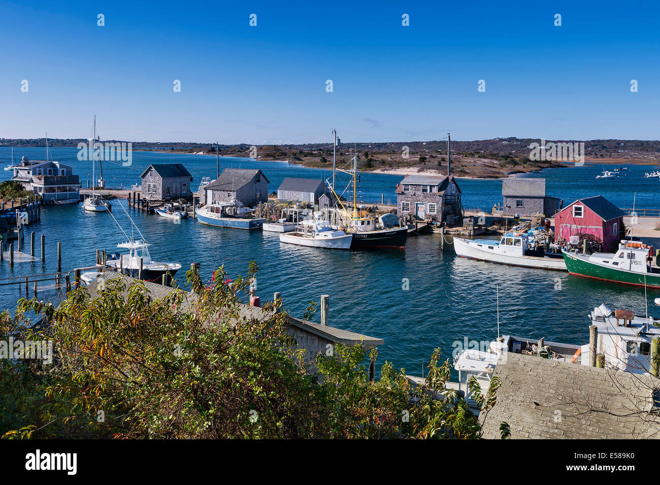 Overview of fishing shacks and boats in the village of Menemsha ...