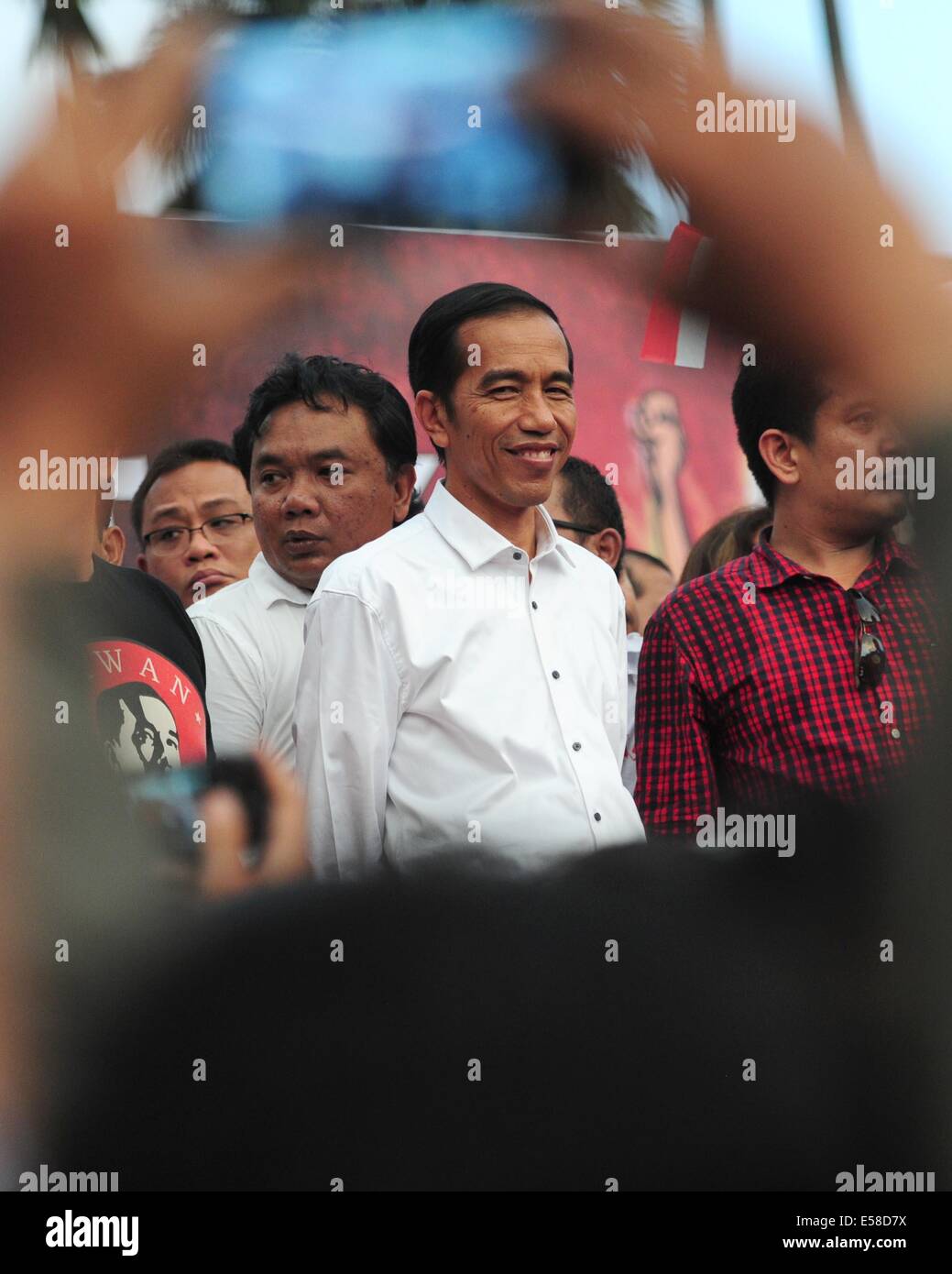 Jakarta, Indonesia. 23rd July, 2014. Joko Widodo (C) smiles as he ...