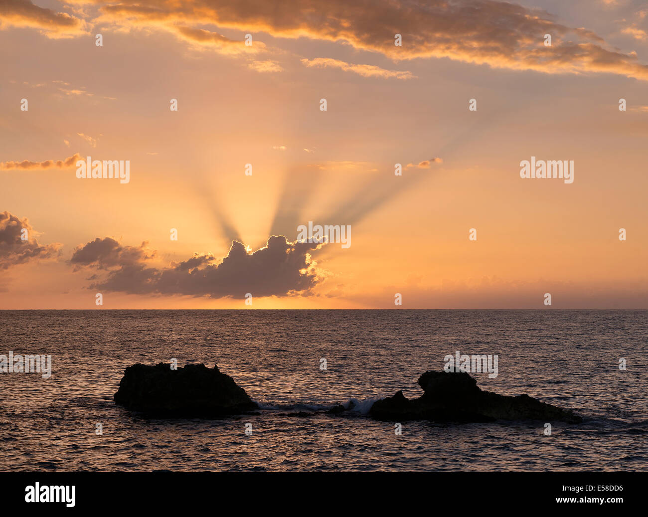 Volcanic ocean rocks at sunset, Negril, Jamaica Stock Photo - Alamy
