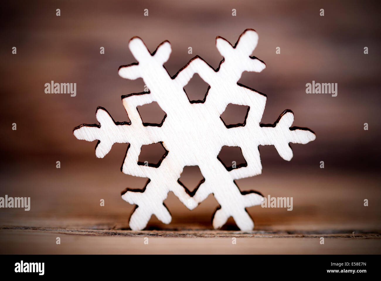 A Single Snowflake on Wood, Winter Background Stock Photo - Alamy