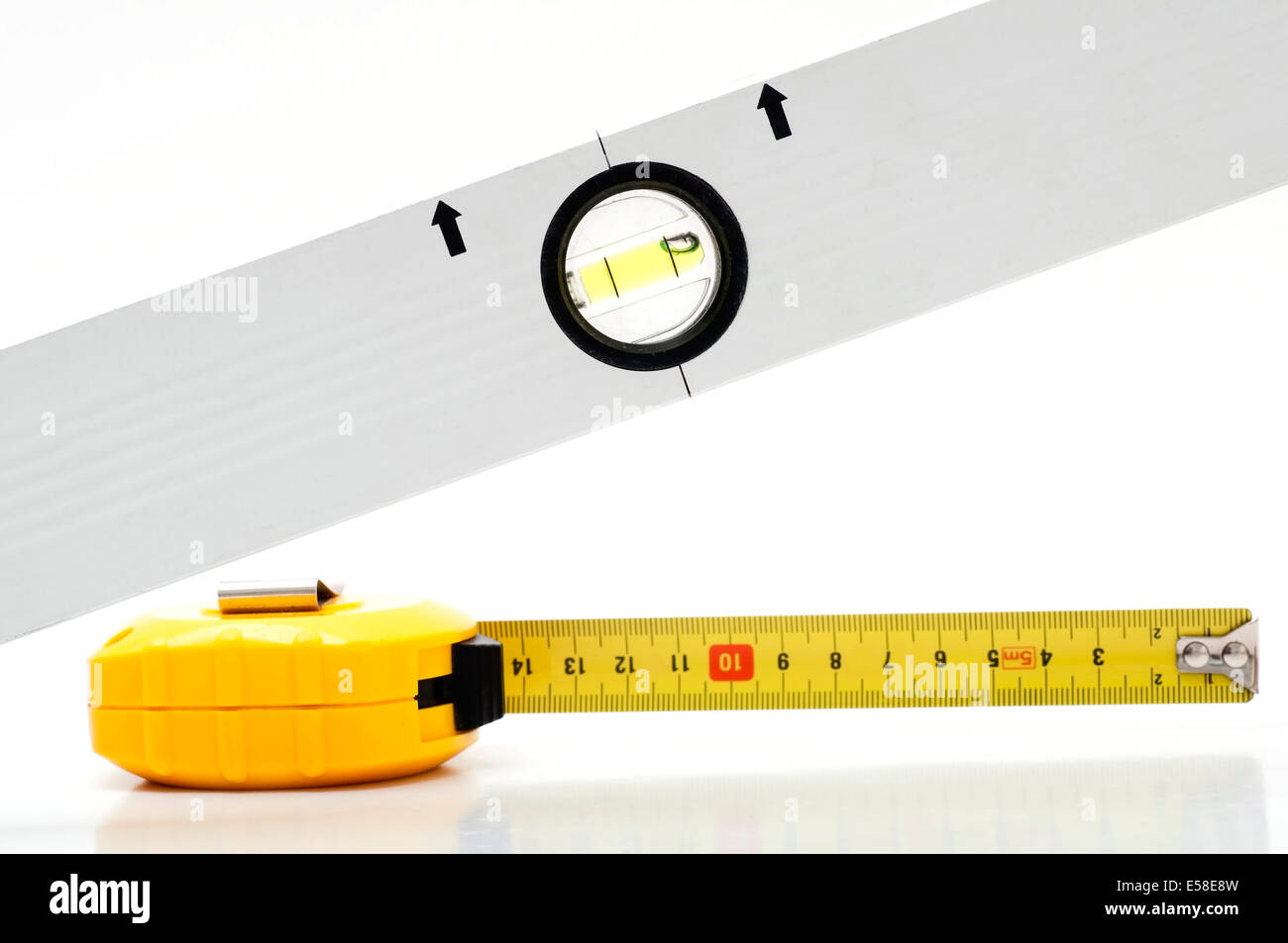 Spirit level and the measure together Stock Photo - Alamy
