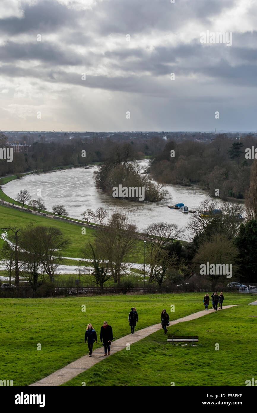 The River Thames at full flow after flooding as seen from the hill ...
