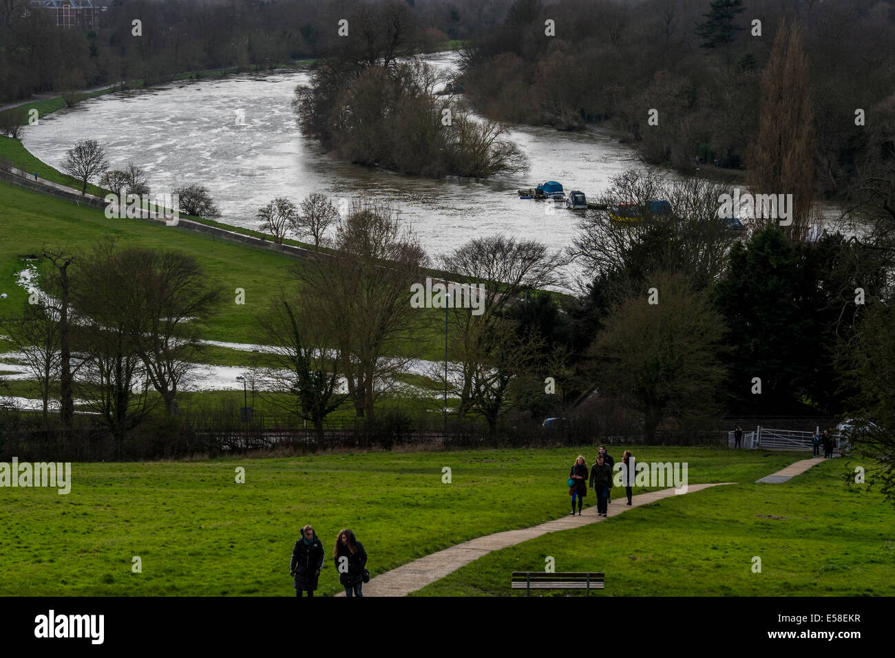 The River Thames at full flow after flooding as seen from the hill ...