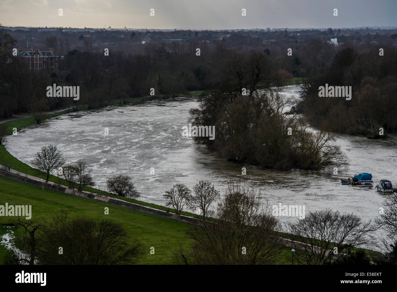 The River Thames at full flow after flooding as seen from the hill ...