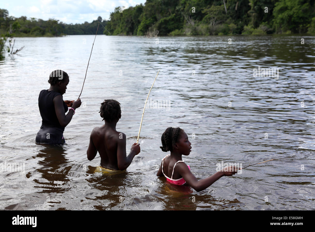 Children fishing in the river of Suriname, Suriname, Latin America ...