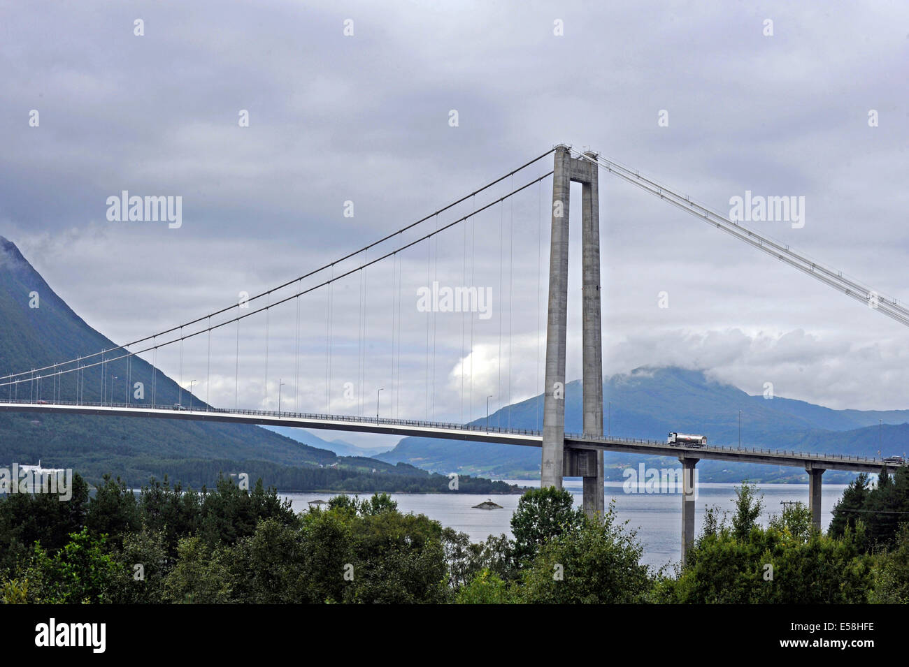 Cars are passing ta bridge, part of the Atlantic Ocean Road, in western ...
