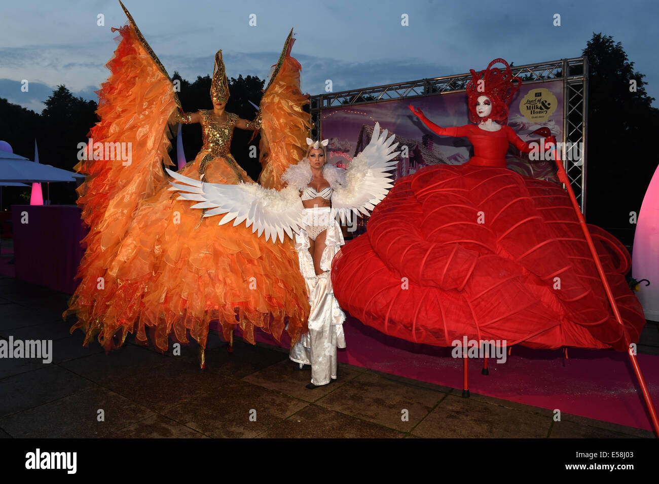 Munich, Germany. 22nd July, 2014. Stilt walkers pose during the summer ...