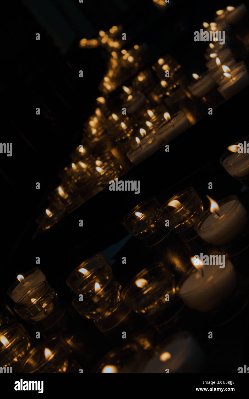Romantic glowing long row of candlelight burning Stock Photo - Alamy